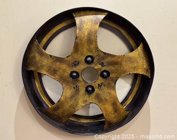 Two metal stylized wheel rim wall decor | Maxsold