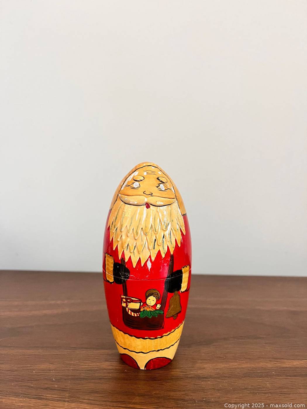 Wooden hand-painted Santa nesting dolls | Maxsold