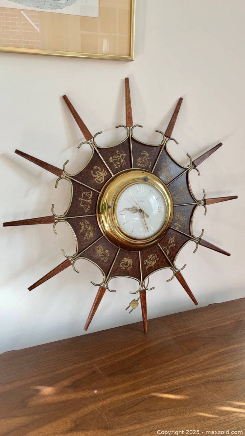 United Starburst Zodiac Wall Clock | Maxsold