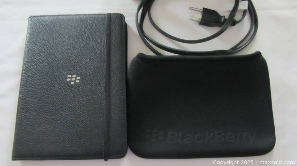 BlackBerry PlayBook tablet with charging pod, power cord, leather folio ...