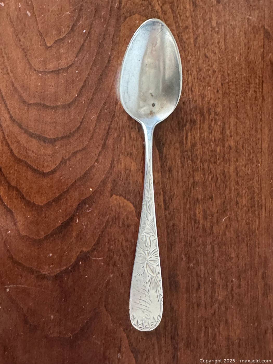 Four engraved silver spoons | Maxsold