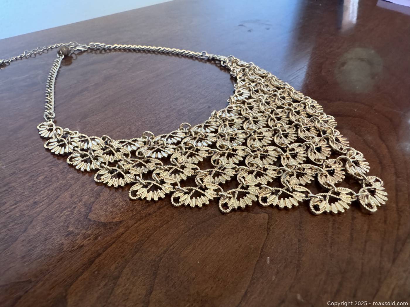 Gold tone bib statement necklace | Maxsold