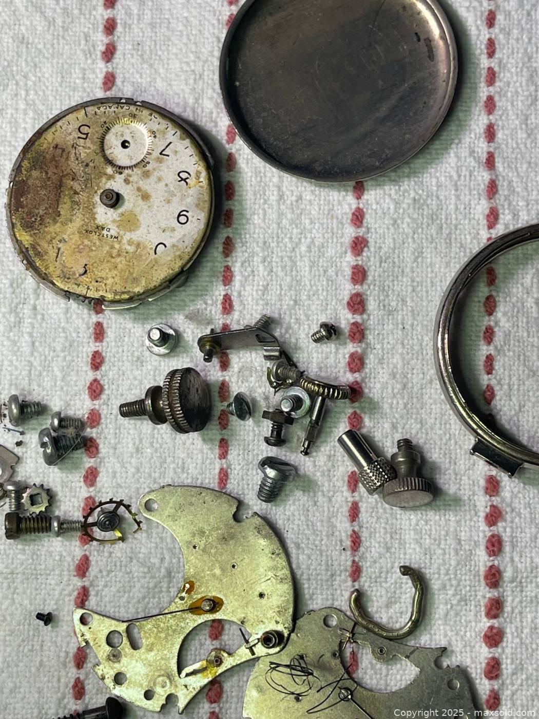 Assorted antique pocket watch parts | Maxsold