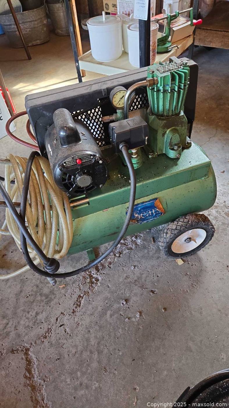 Sears portable wheeled air compressor | Maxsold