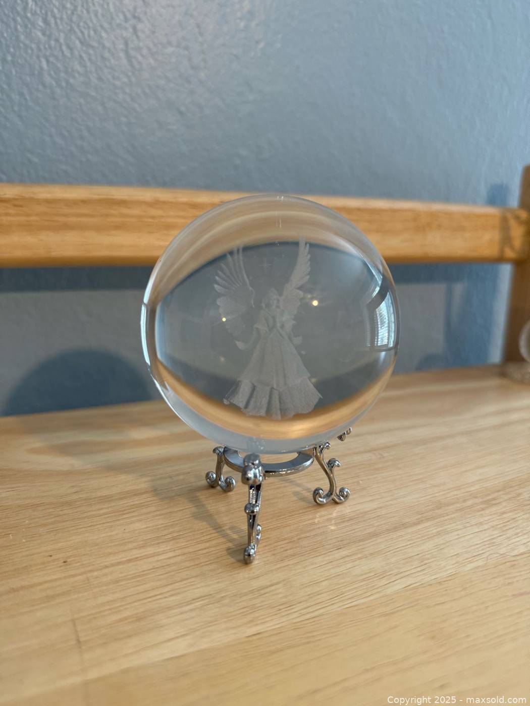 Crystal sphere with 3D etched angel on stand | Maxsold