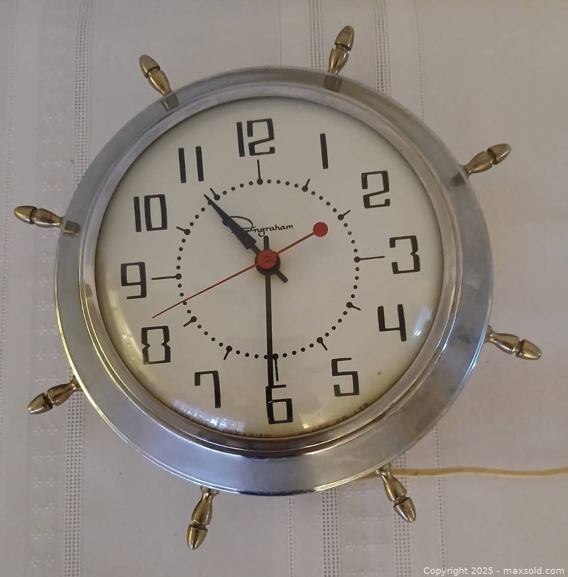 Ingraham chrome ship’s wheel electric wall clock | Maxsold