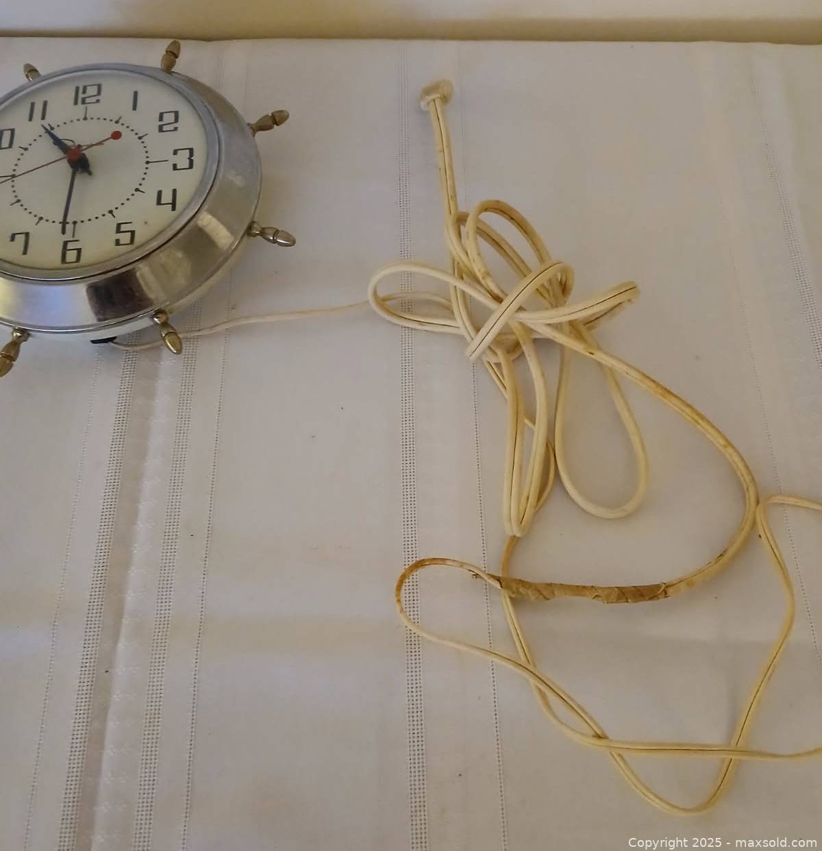 Ingraham chrome ship’s wheel electric wall clock | Maxsold
