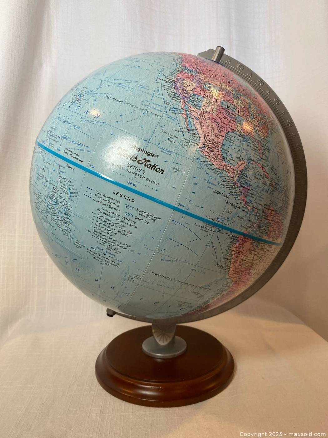 12" Replogle world globe on wood base | Maxsold