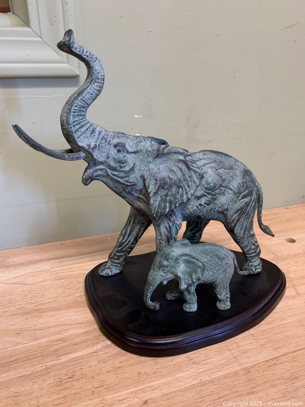 Verdigris metal elephant sculpture on wooden base | Maxsold