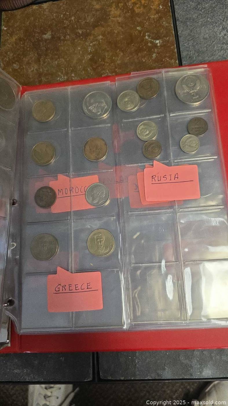 World coin collection in red binder | Maxsold