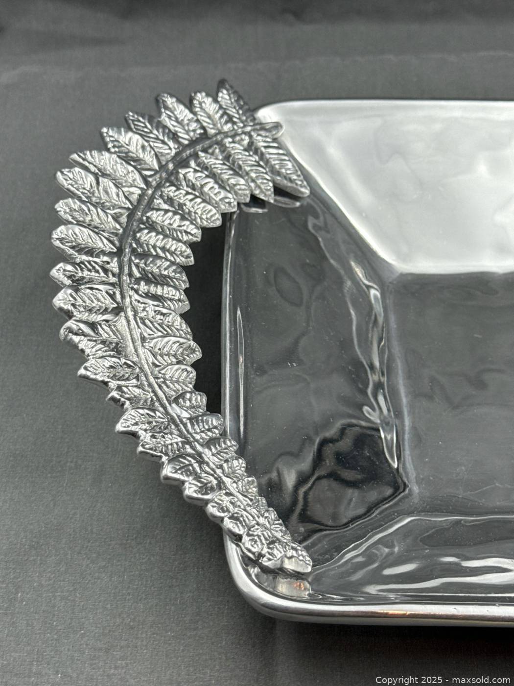 Metal decorative tray with leaf handles | Maxsold