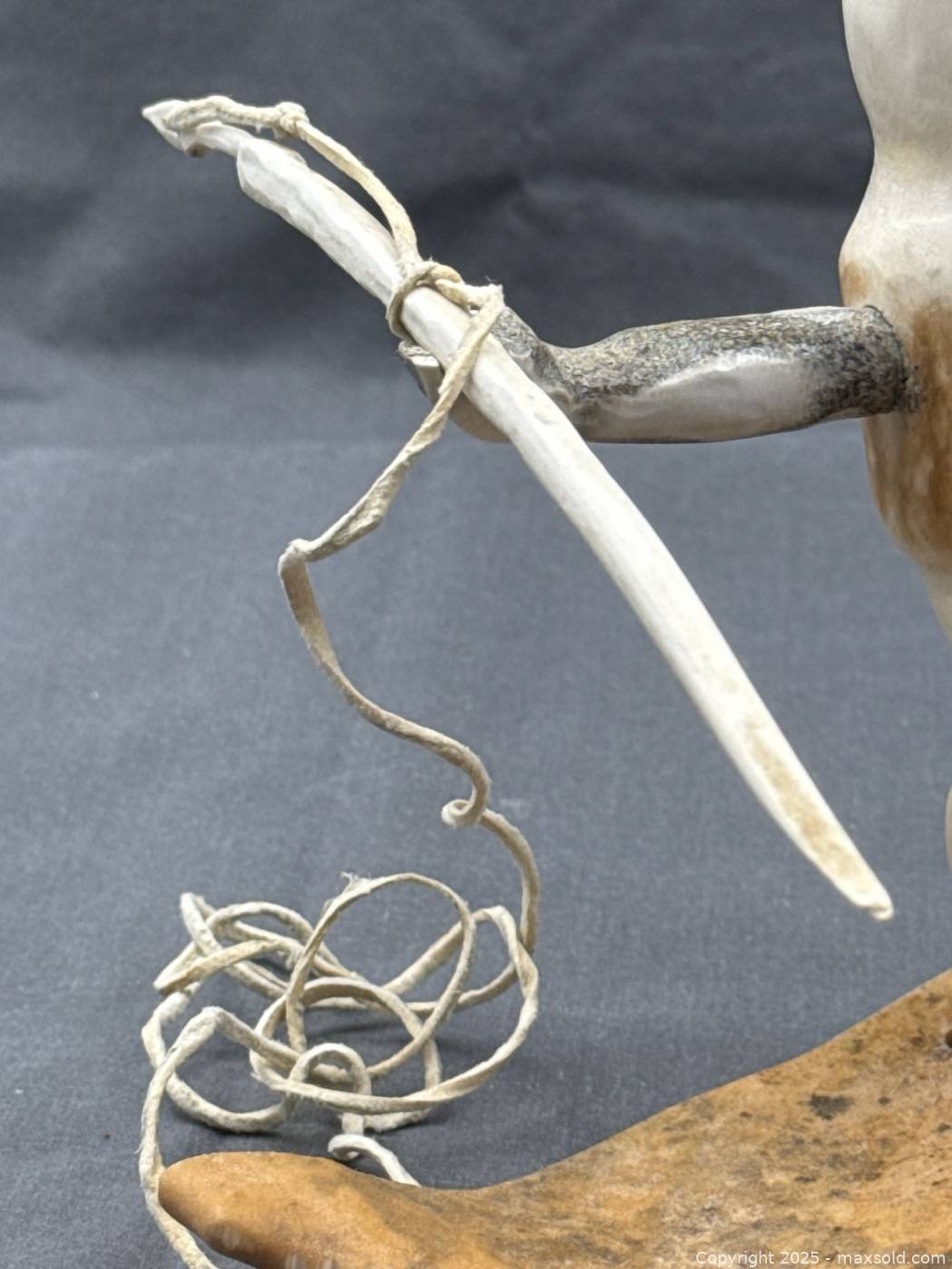 Inuit bone and antler hunter sculpture | Maxsold