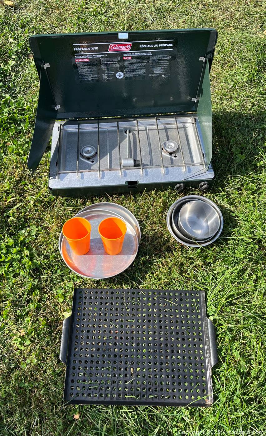 Coleman propane stove, grill topper, plates, bowls, cups | Maxsold