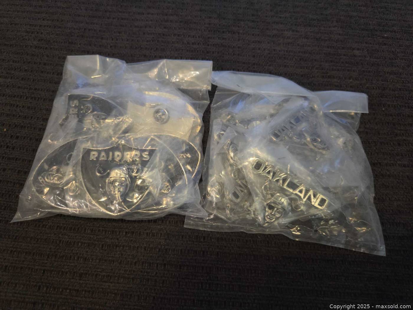 New Oakland Raiders metal lapel pins | Maxsold