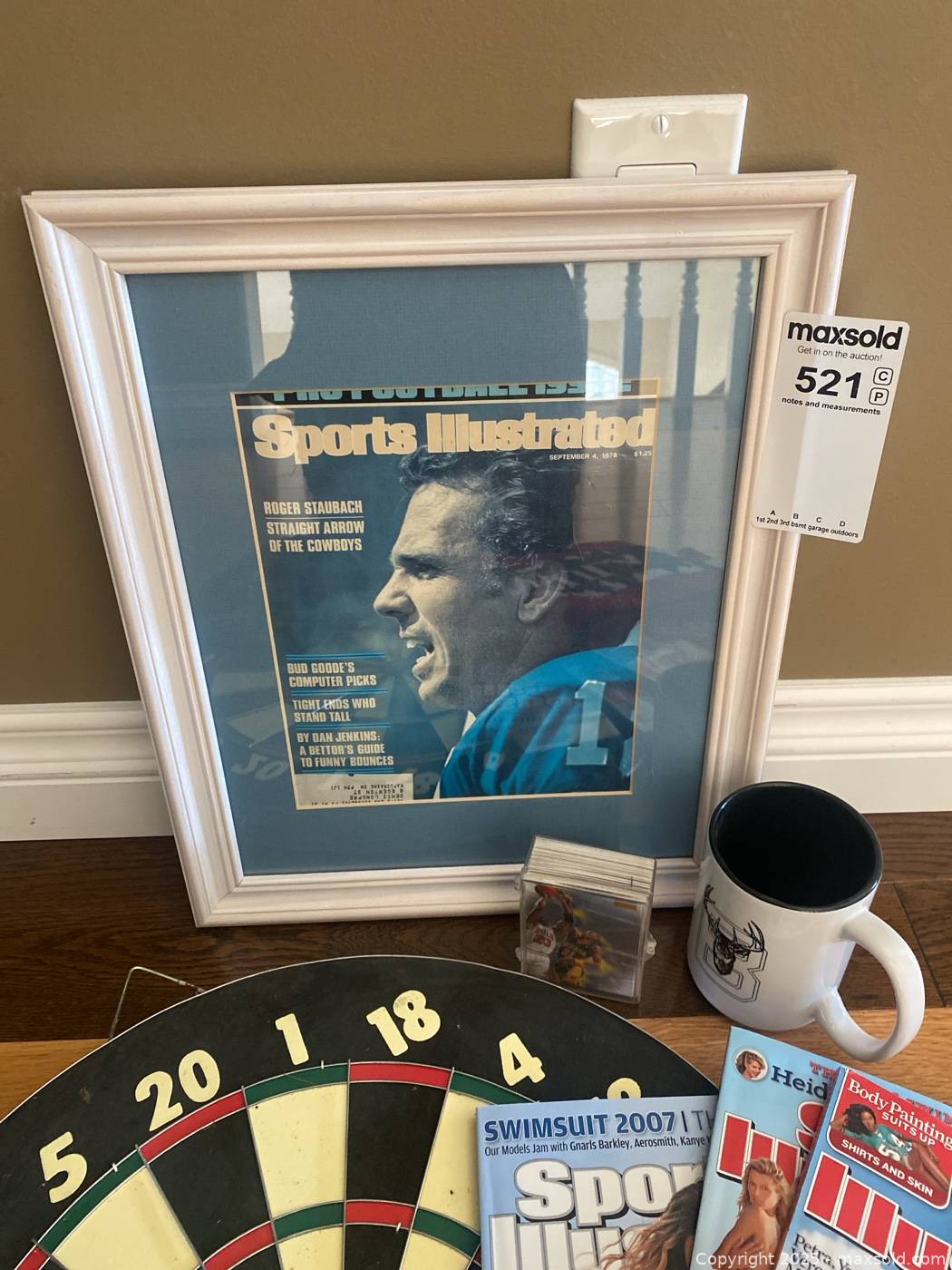 Sports Illustrated decor, dartboard and more | Maxsold