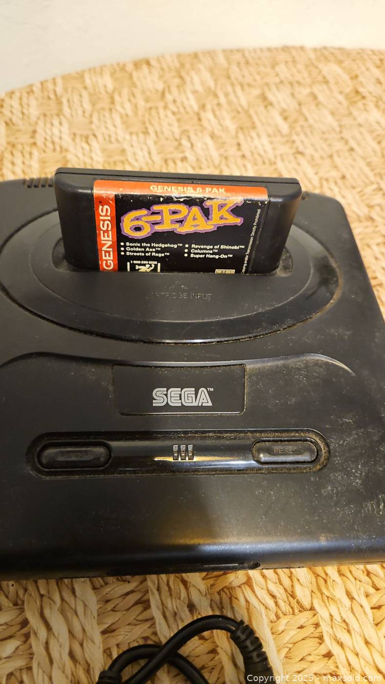 Sega Genesis console with 6-Pak game | Maxsold