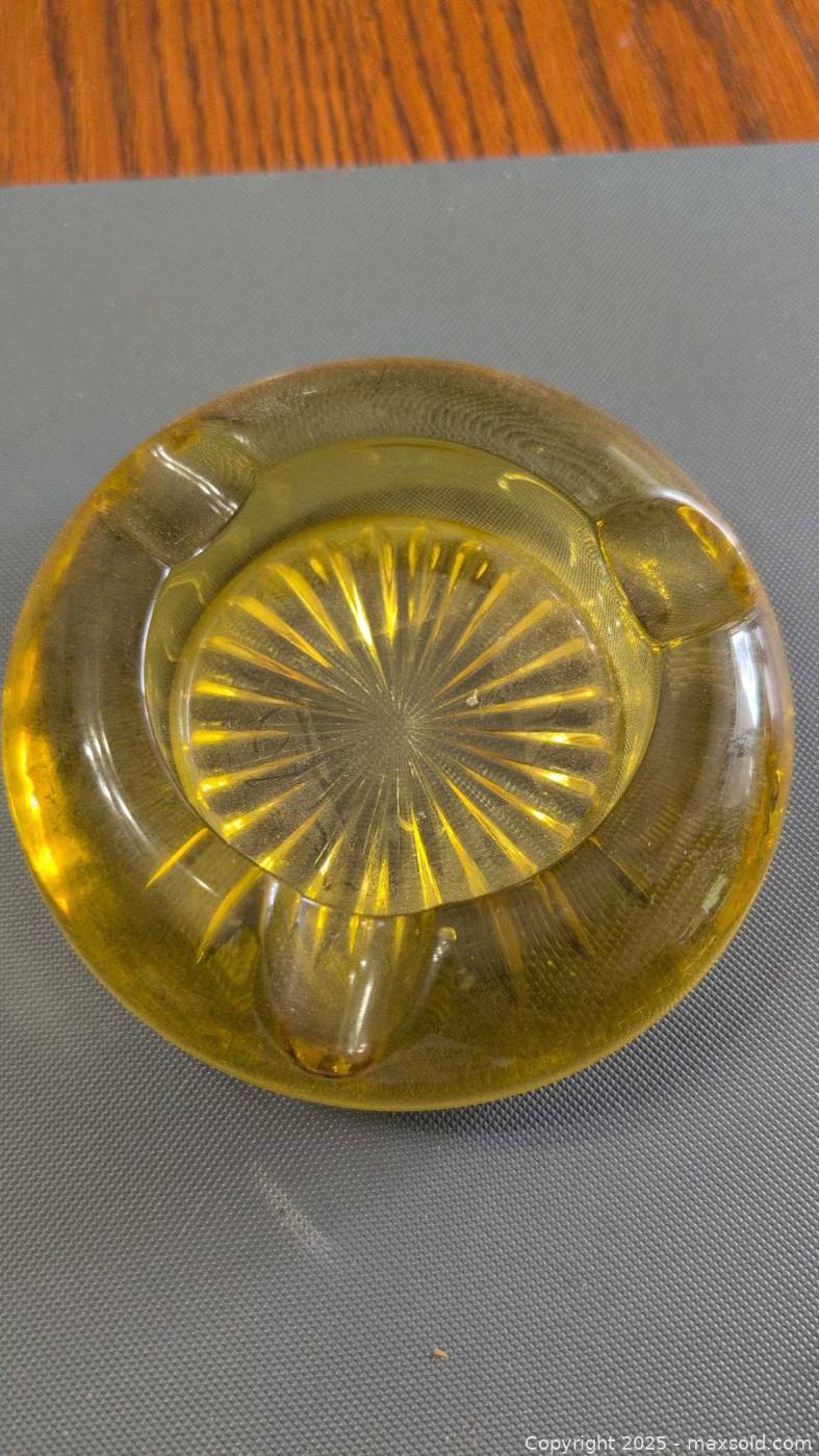 Yellow glass ashtray | Maxsold