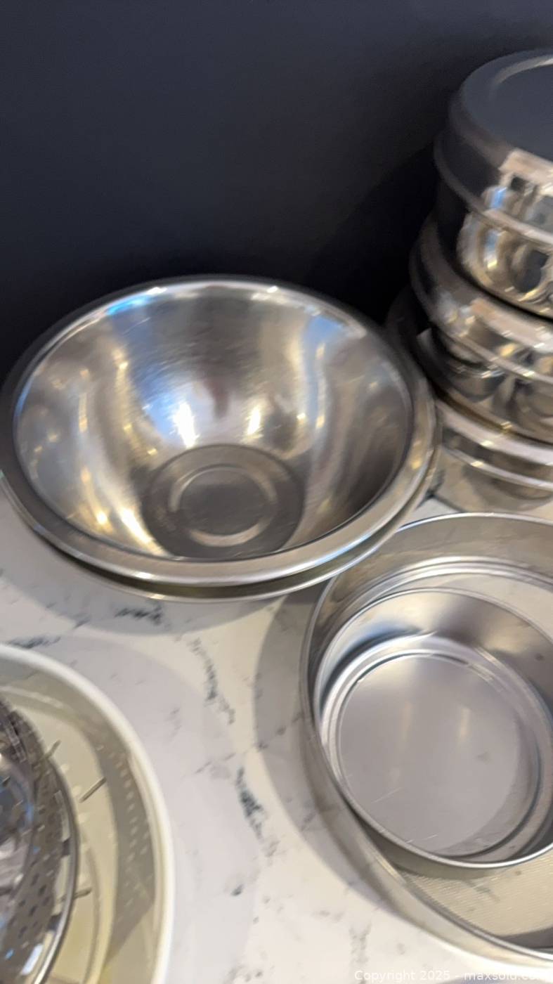 Stainless steel cookware, bowls, containers, steamer, racks | Maxsold