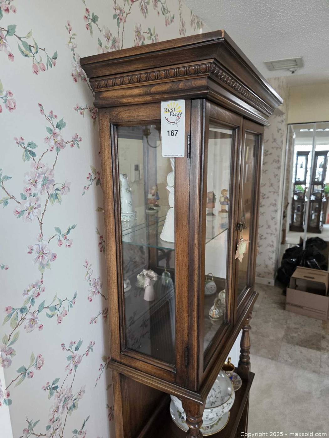 Butler Specialty walnut curio cabinet | Maxsold