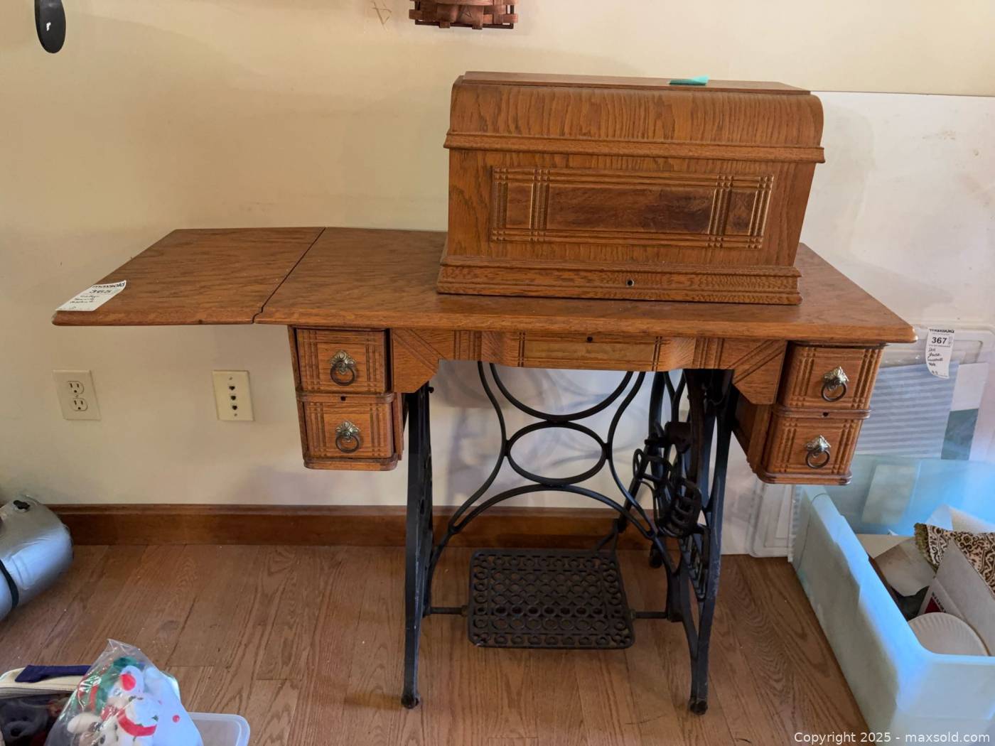 New Home "New Ideal" treadle sewing machine with oak cabinet | Maxsold