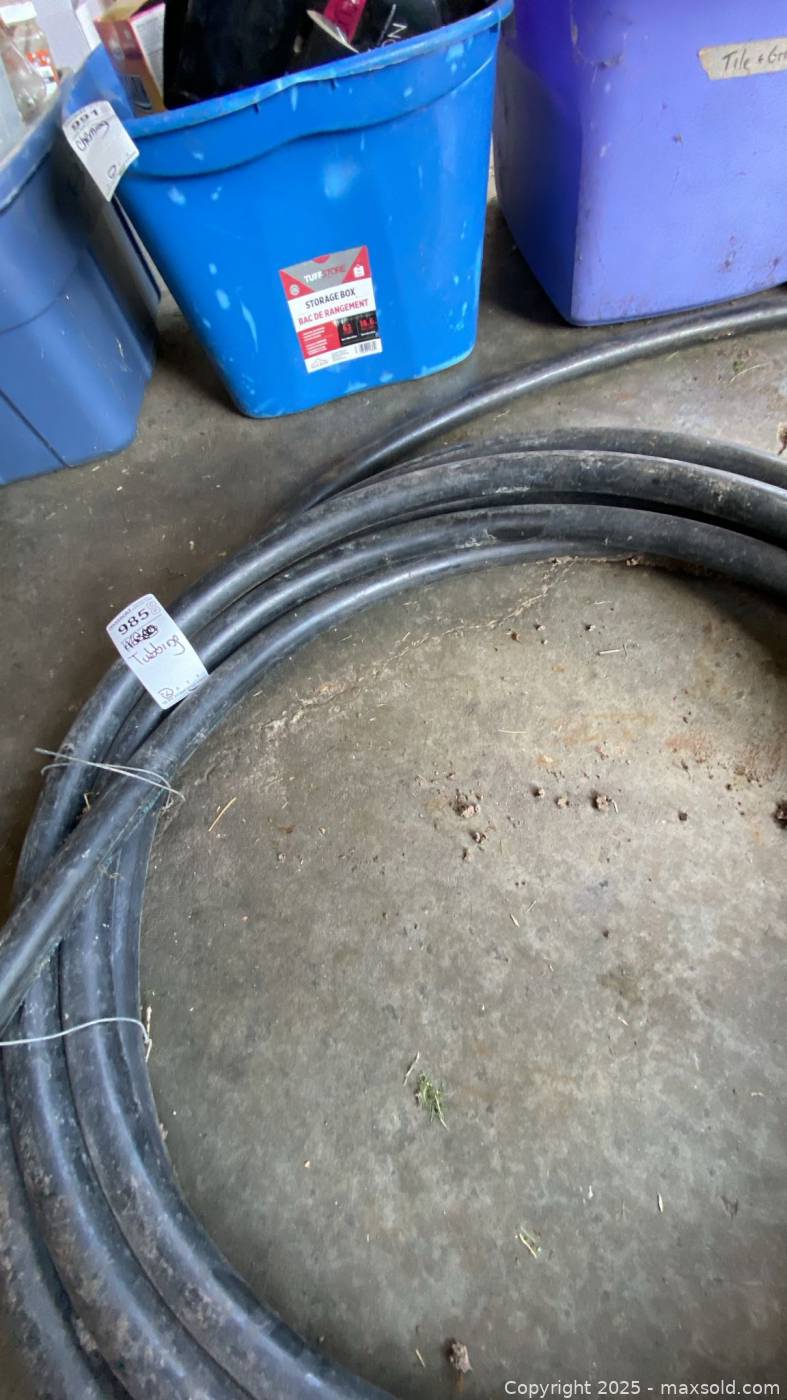 Coiled Black Rubber Hose Pipe | Maxsold