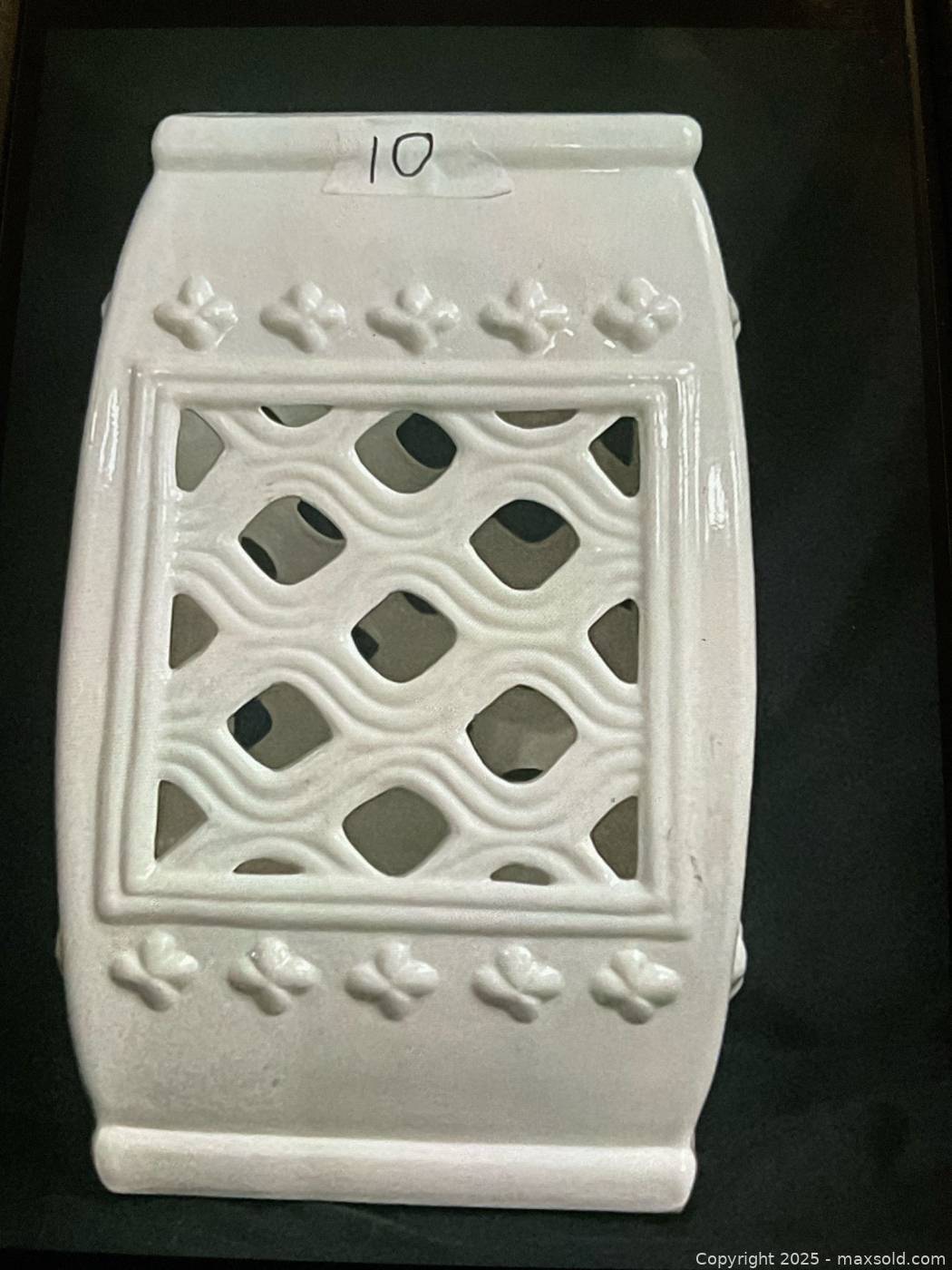 White glazed ceramic openwork stand | Maxsold