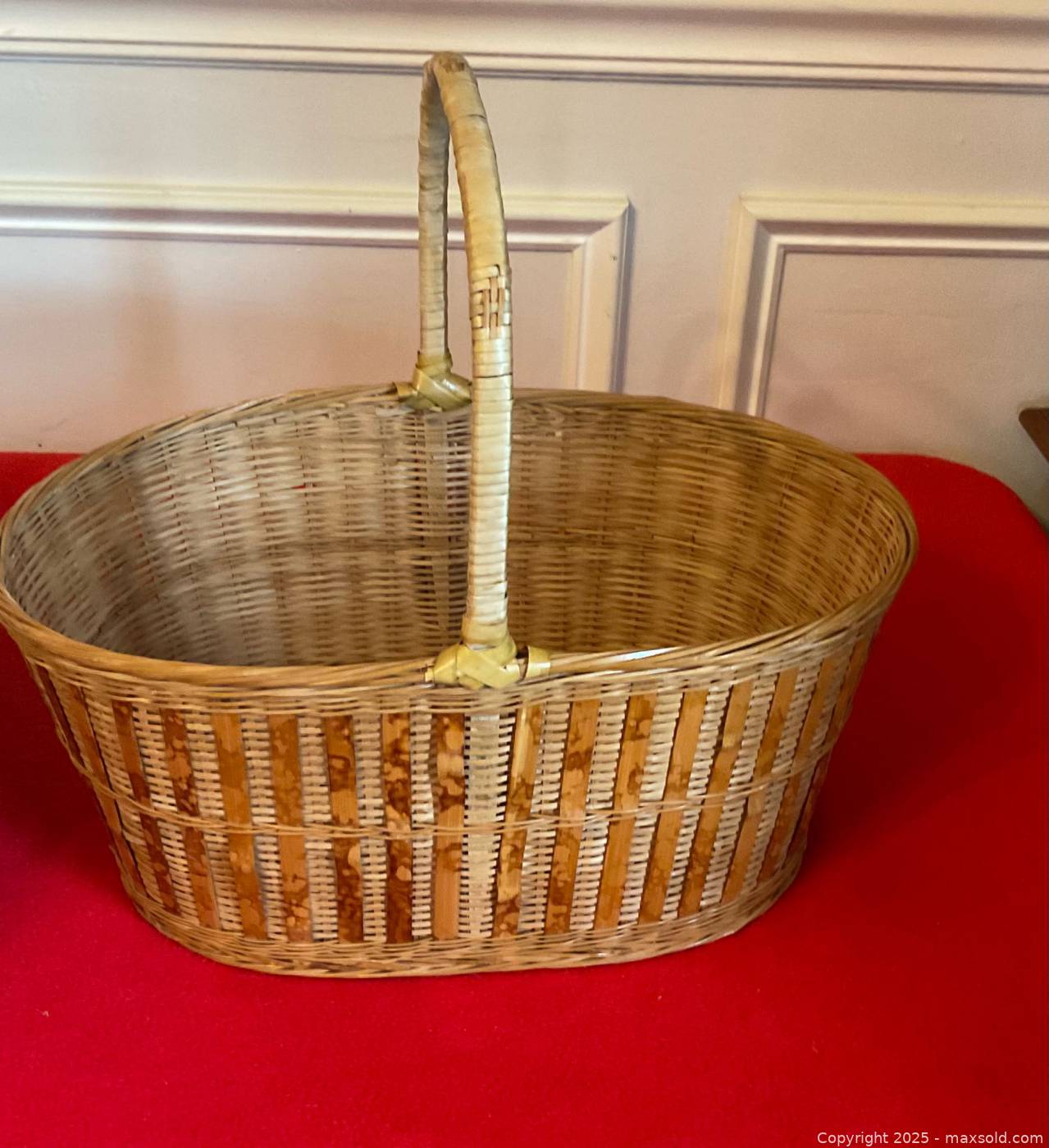 Pair of round shallow wicker baskets | Maxsold