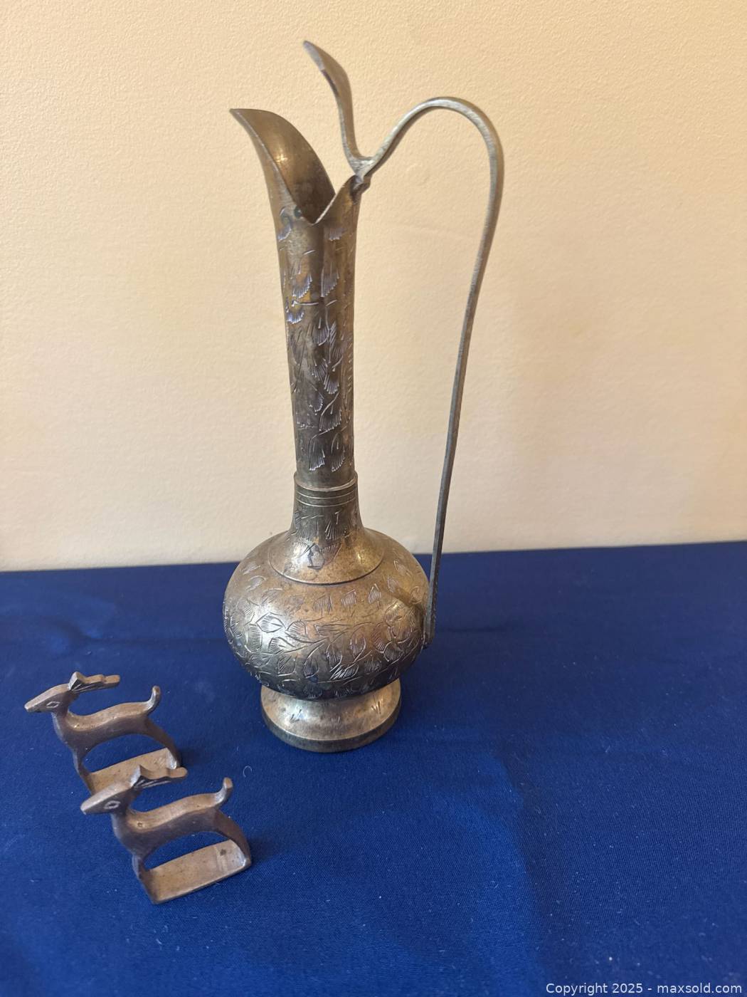 Decorative brass ewer, candlesticks, bells & assorted pieces | Maxsold
