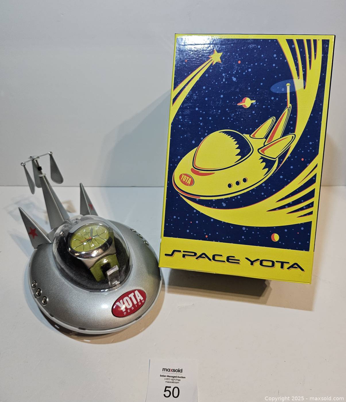 Space Yota watch with spaceship tin display | Maxsold