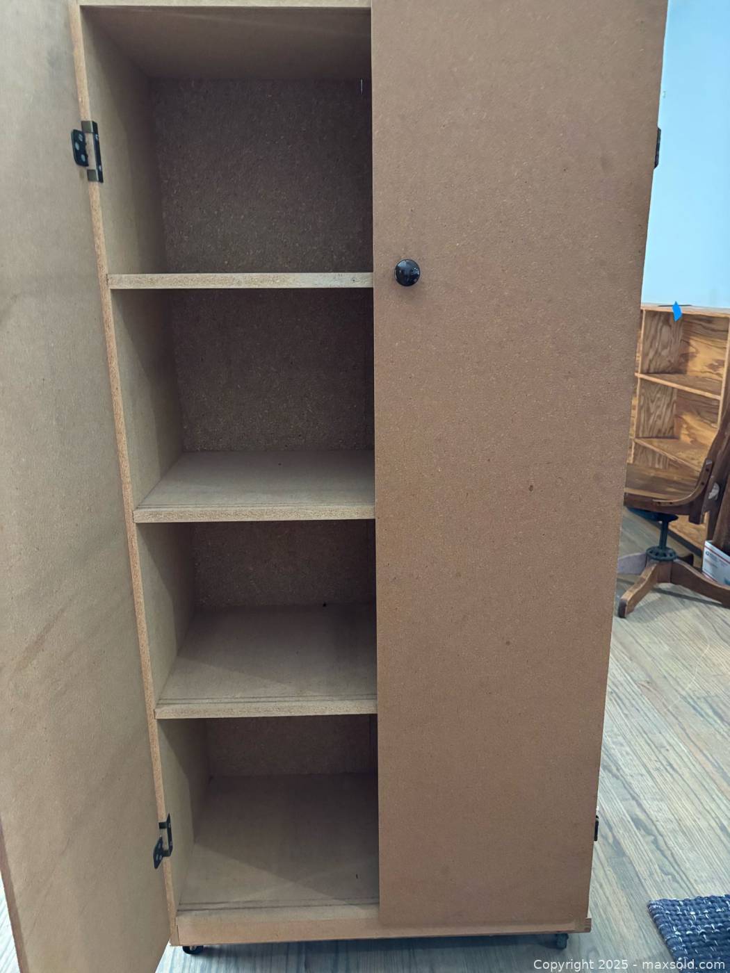 Particle board storage cabinet on casters | Maxsold