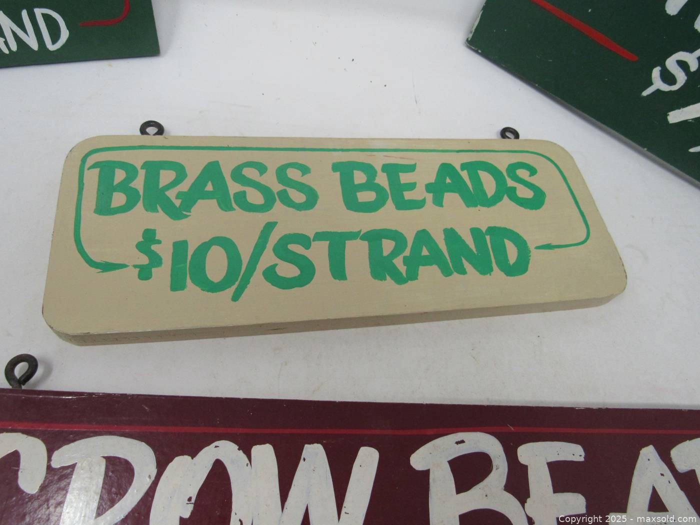 Four wooden bead price signs | Maxsold
