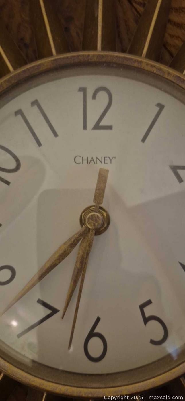 Chaney quartz sunburst wall clock 22 in | Maxsold
