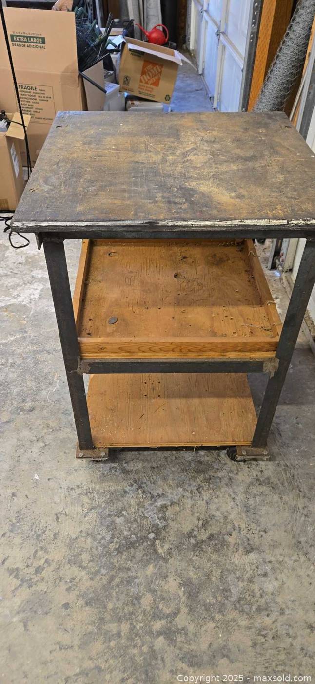Rolling steel-frame work table on casters | Maxsold