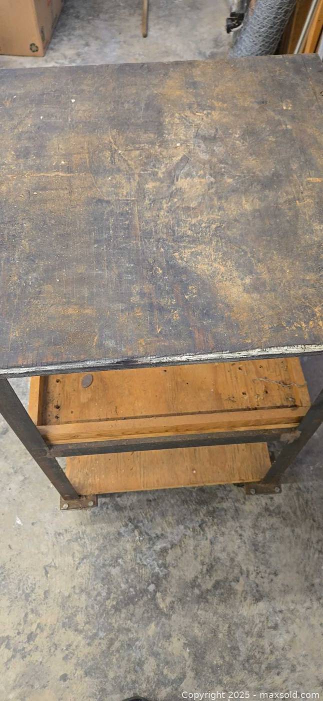 Rolling steel-frame work table on casters | Maxsold