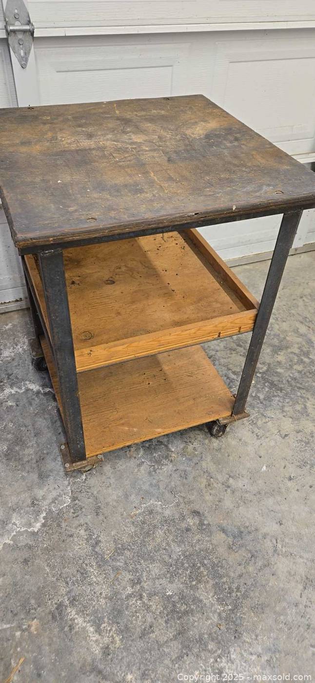 Rolling steel-frame work table on casters | Maxsold