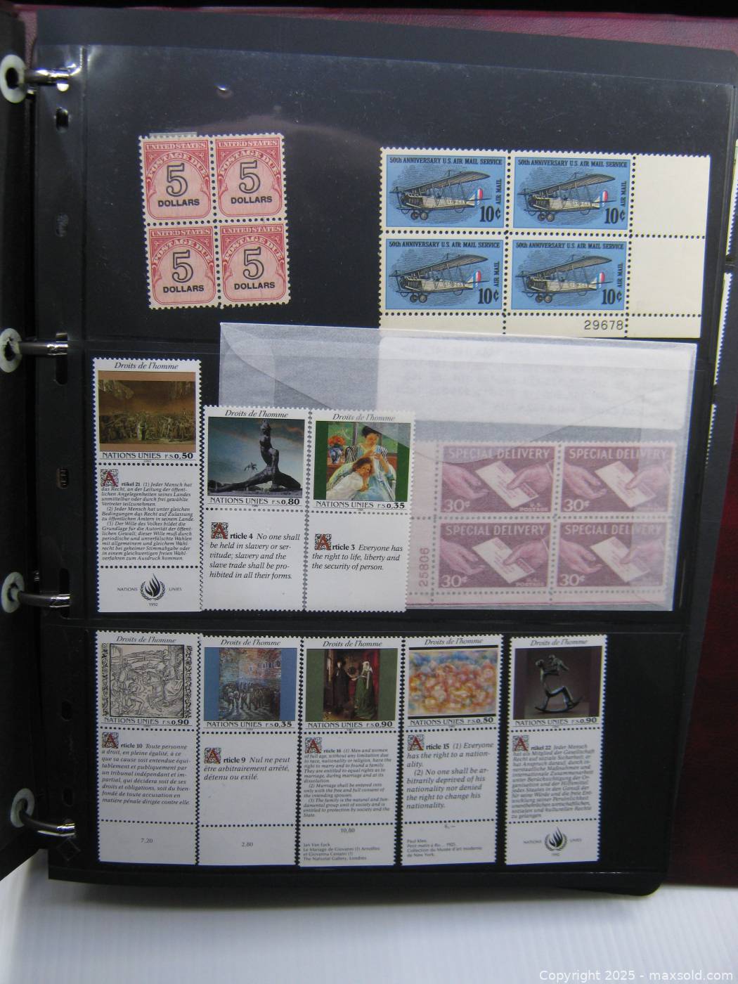 Old stamp album with US and UN stamps | Maxsold