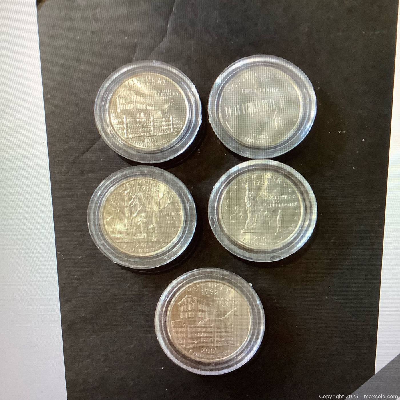 18 Uncirculated State Quarters in Capsules | Maxsold