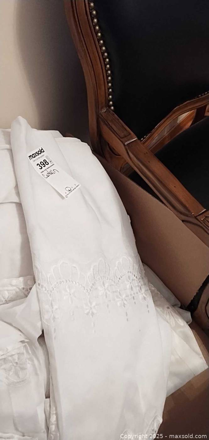 White embroidered curtain panels and small fringed woven runner | Maxsold