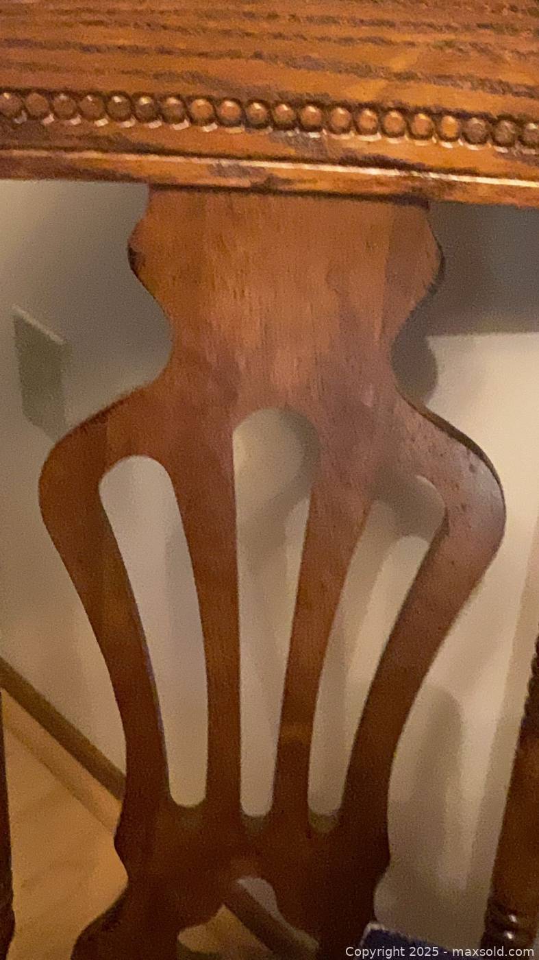 Pair of pressed-back oak dining chairs | Maxsold