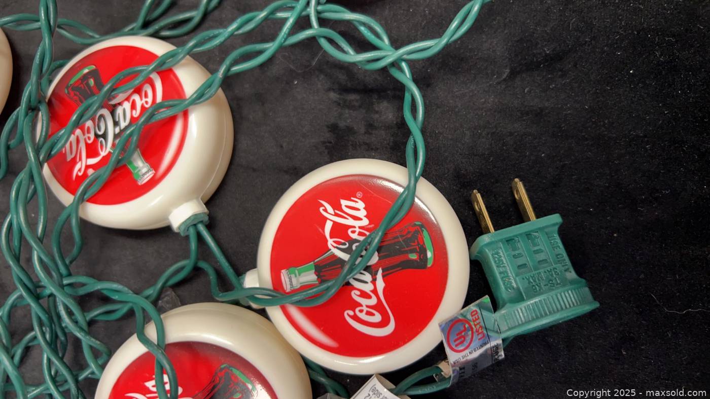 Coca-Cola glasses, metal drawer tower, string lights | Maxsold