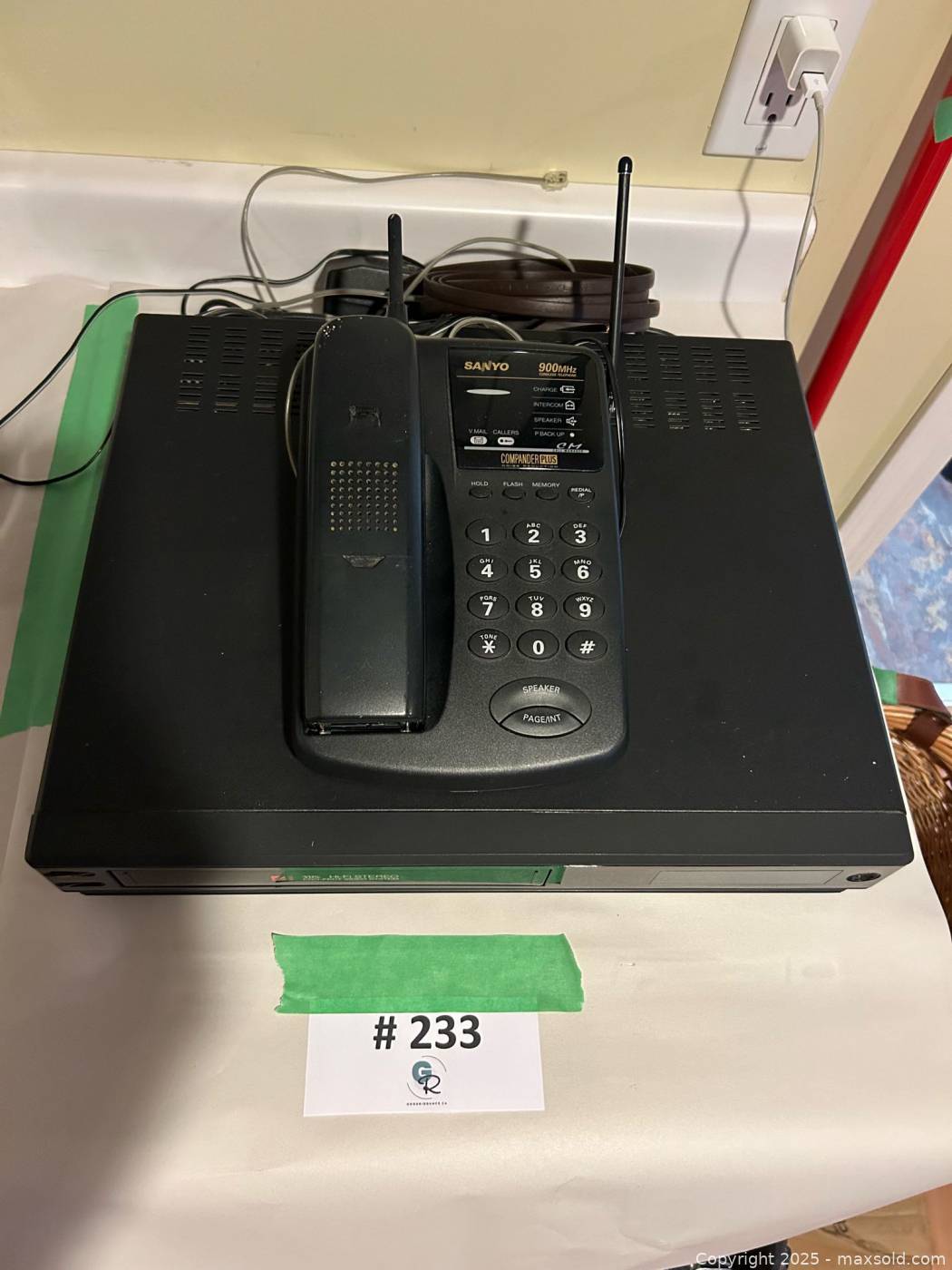 Sanyo cordless phone and GE VHS player | Maxsold