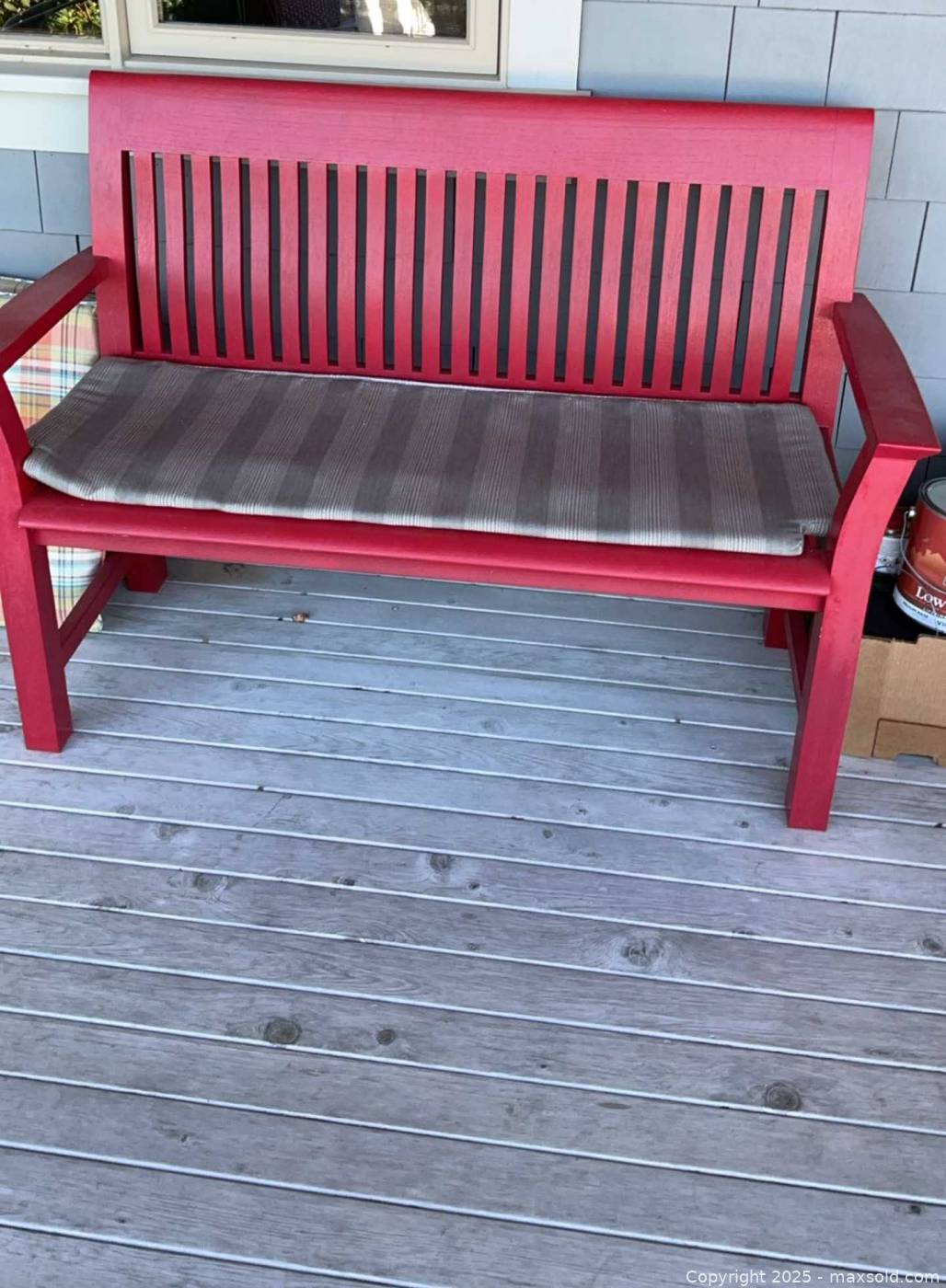 Red painted wood bench with cushions | Maxsold
