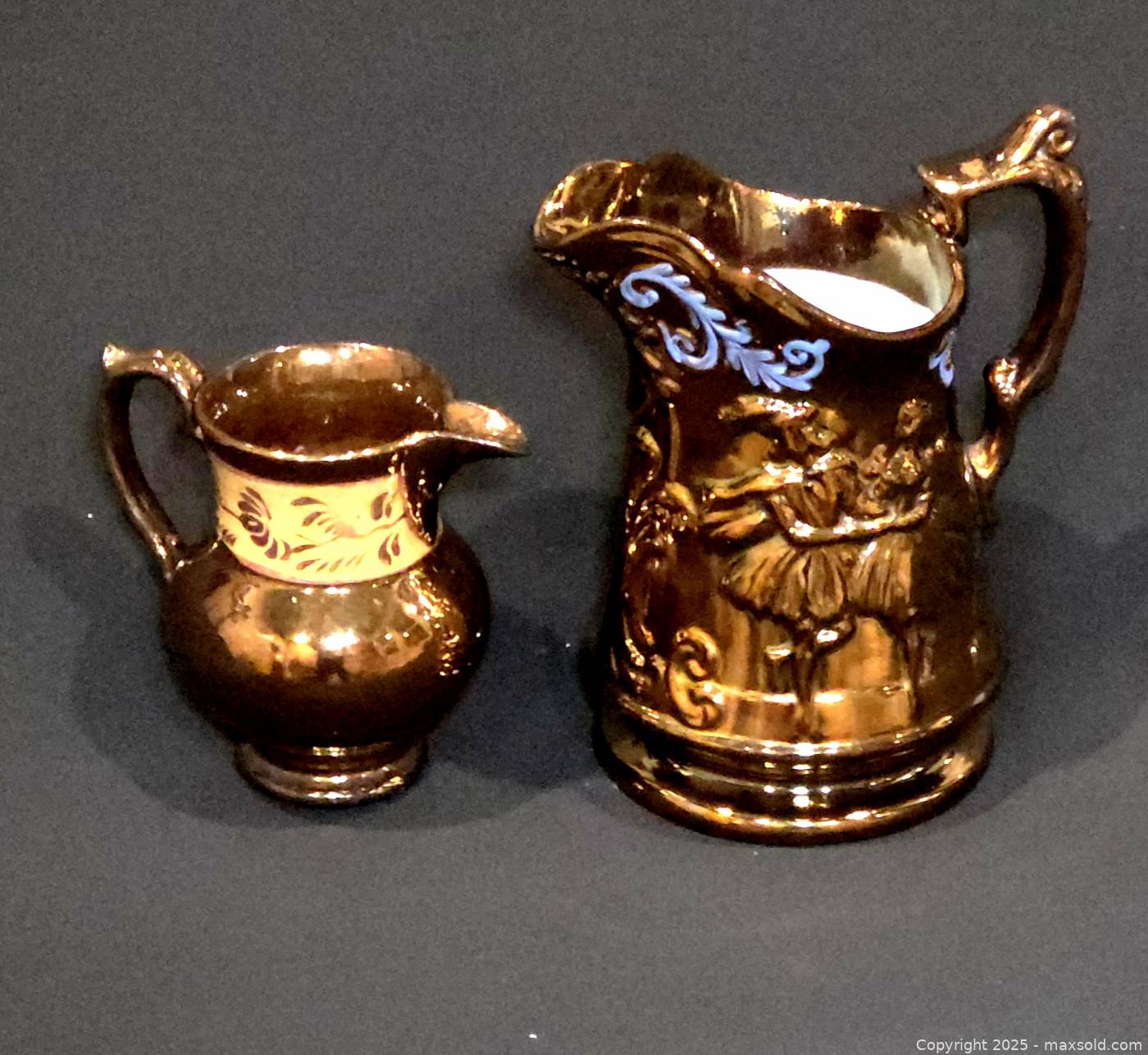 Pair of antique copper lustreware pitchers | Maxsold