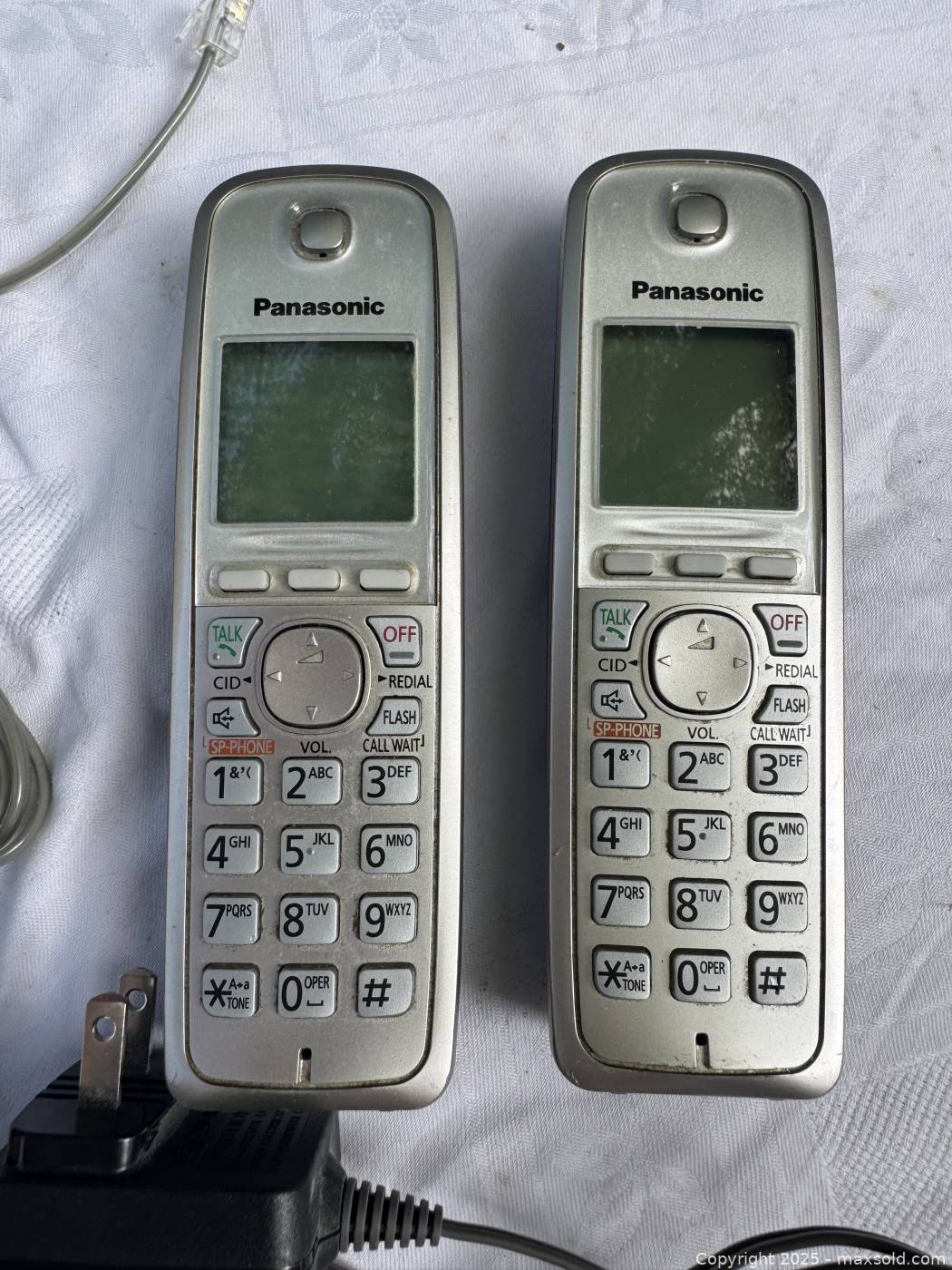 Panasonic cordless phone system with two handsets, base cradle, extra ...