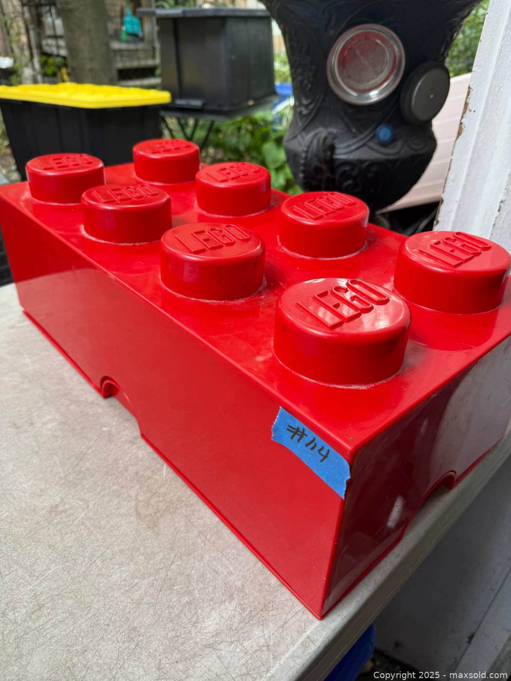 Big red LEGO storage bin with assorted bricks | Maxsold