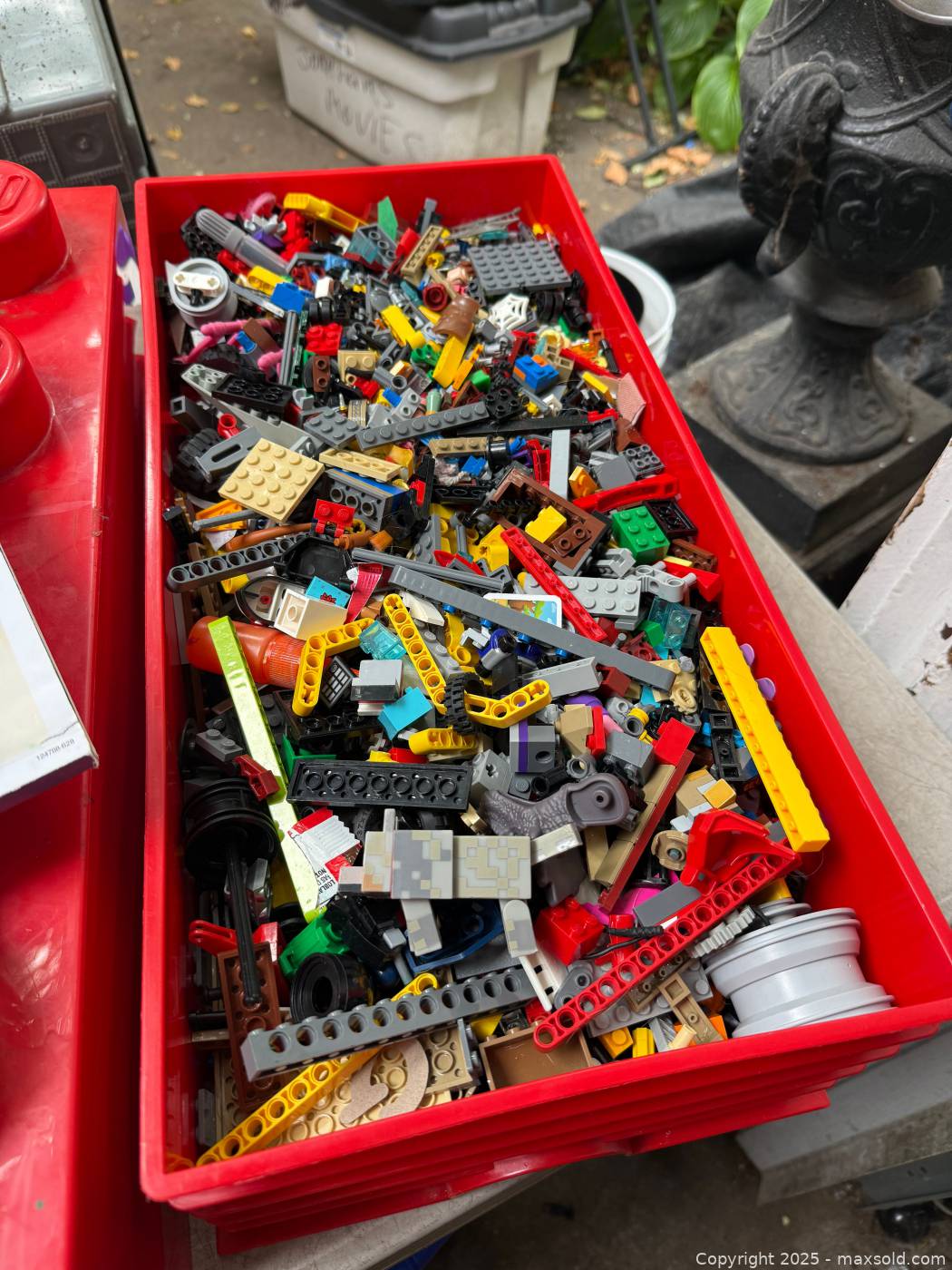Big red LEGO storage bin with assorted bricks | Maxsold
