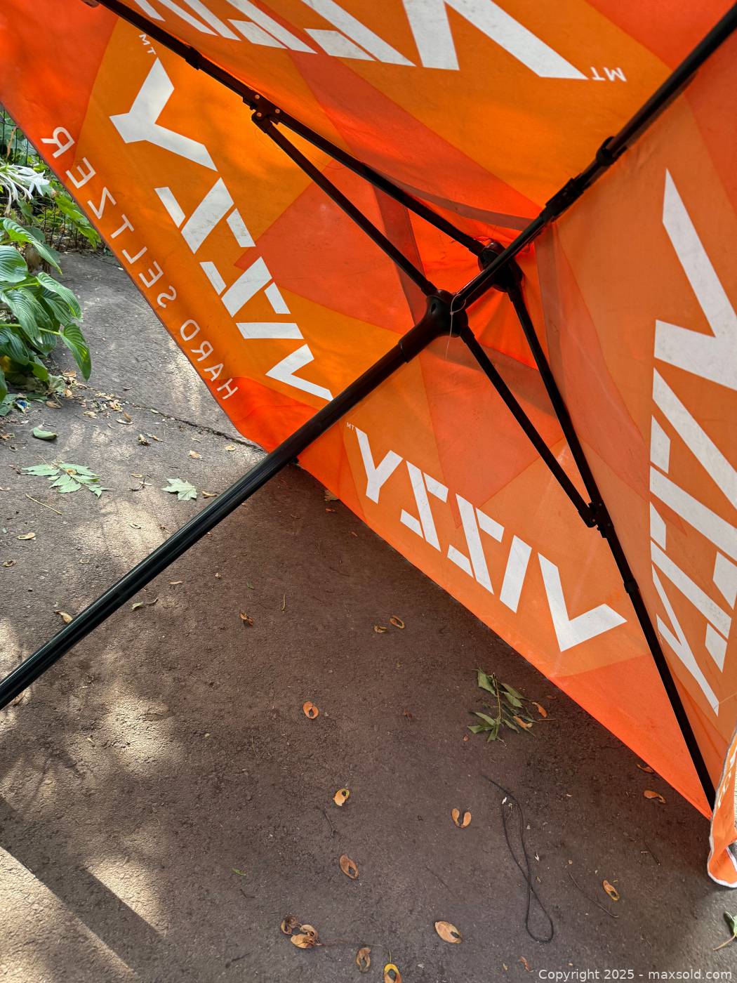 Vizzy Hard Seltzer patio umbrella | Maxsold