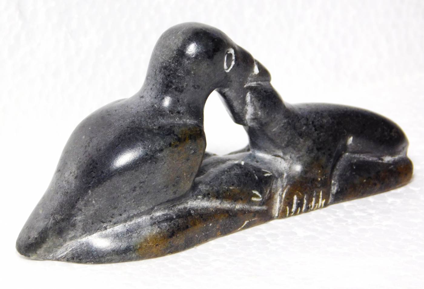 Inuit soapstone carving giant bird eating seal | Maxsold
