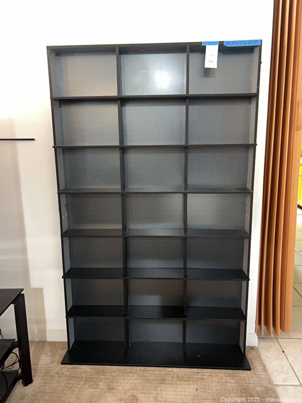 Black laminate cubby bookshelf 37.25x7.5x60.25 | Maxsold