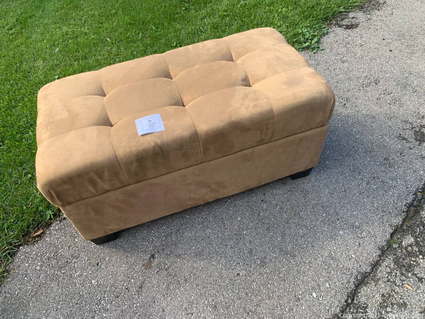 Beige upholstered storage ottoman | Maxsold